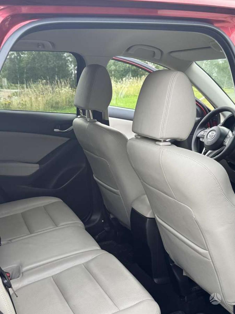 Red Mazda CX-5 2012 in Vilnius, with an engine capacity of 2.19 L and mileage of 185 thousand km for 8300 €, photo 10 on AUTOMOTO.COM.LV