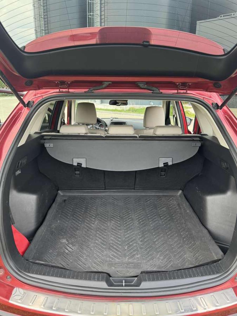 Red Mazda CX-5 2012 in Vilnius, with an engine capacity of 2.19 L and mileage of 185 thousand km for 8300 €, photo 12 on AUTOMOTO.COM.LV