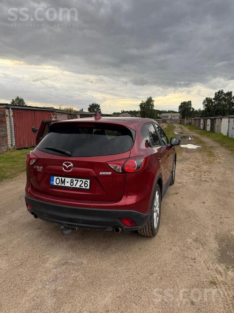 Red Mazda CX-5 2012 in Bauska, with an engine capacity of 2.20 L and mileage of 184 thousand km for 6500 €, photo 14 on AUTOMOTO.COM.LV