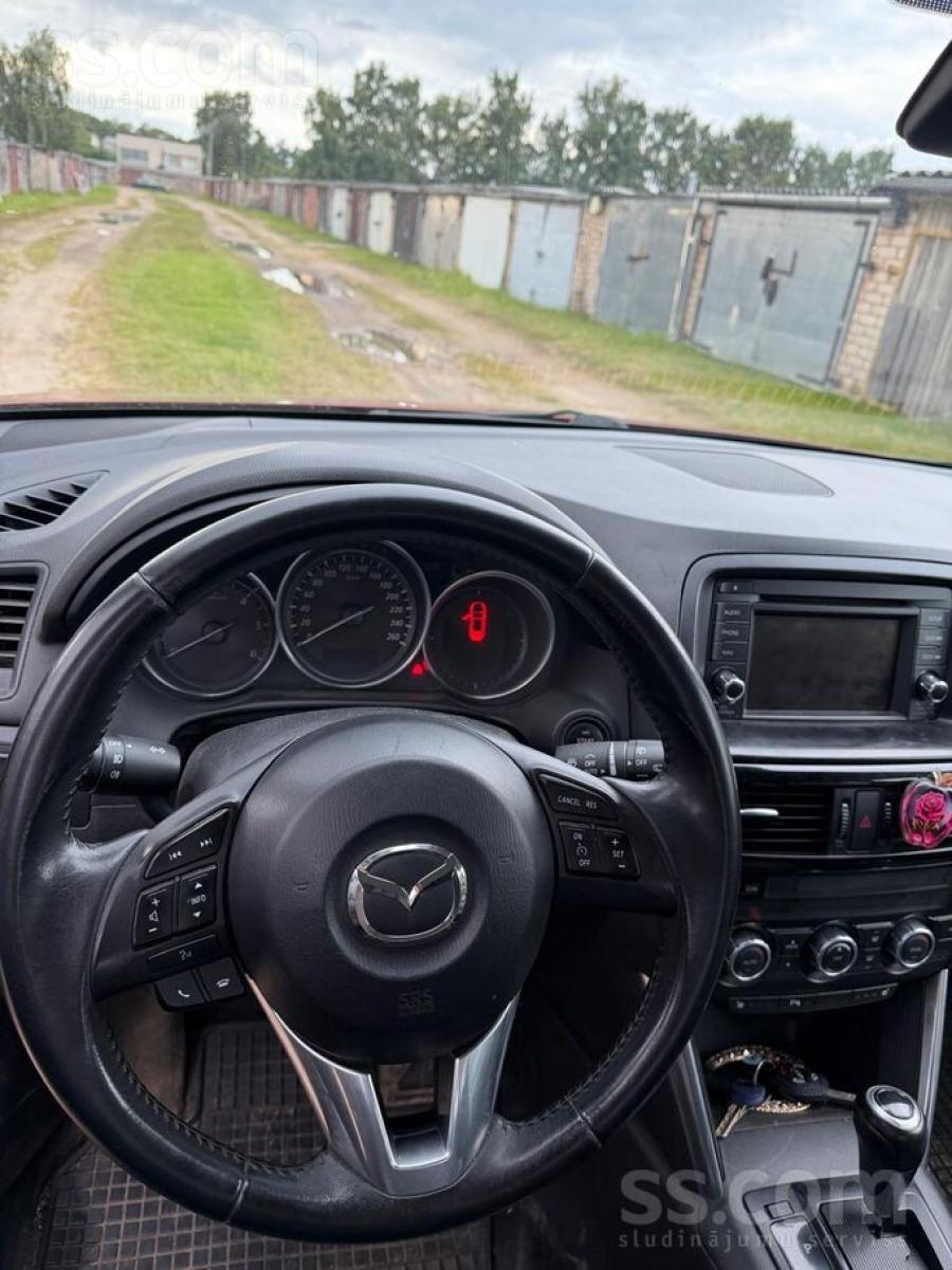 Red Mazda CX-5 2012 in Bauska, with an engine capacity of 2.20 L and mileage of 184 thousand km for 6500 €, photo 18 on AUTOMOTO.COM.LV