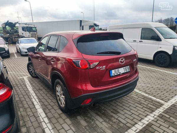 Red Mazda CX-5 2013 in Vilnius, with an engine capacity of 2.20 L and mileage of 243 thousand km for 2900 €, photo 3 on AUTOMOTO.COM.LV