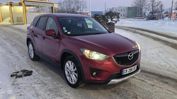 Red Mazda CX-5 2013 in Taurage, with an engine capacity of 2.19 L and mileage of 176 thousand km for 6800 €, photo 1 on AUTOMOTO.COM.LV