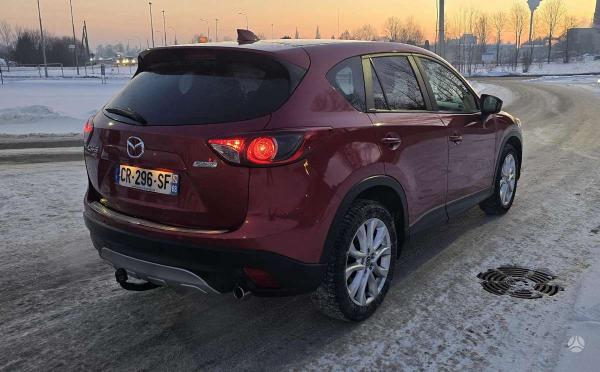 Red Mazda CX-5 2013 in Taurage, with an engine capacity of 2.19 L and mileage of 176 thousand km for 6800 €, photo 7 on AUTOMOTO.COM.LV