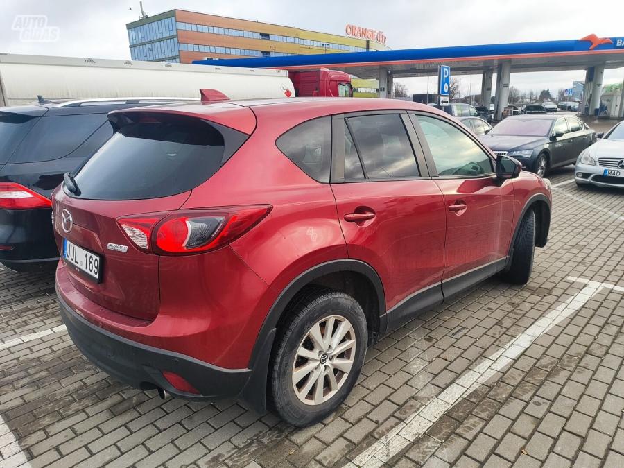 Red Mazda CX-5 2013 in Vilnius, with an engine capacity of 2.20 L and mileage of 220 thousand km for 2750 €, photo 3 on AUTOMOTO.COM.LV