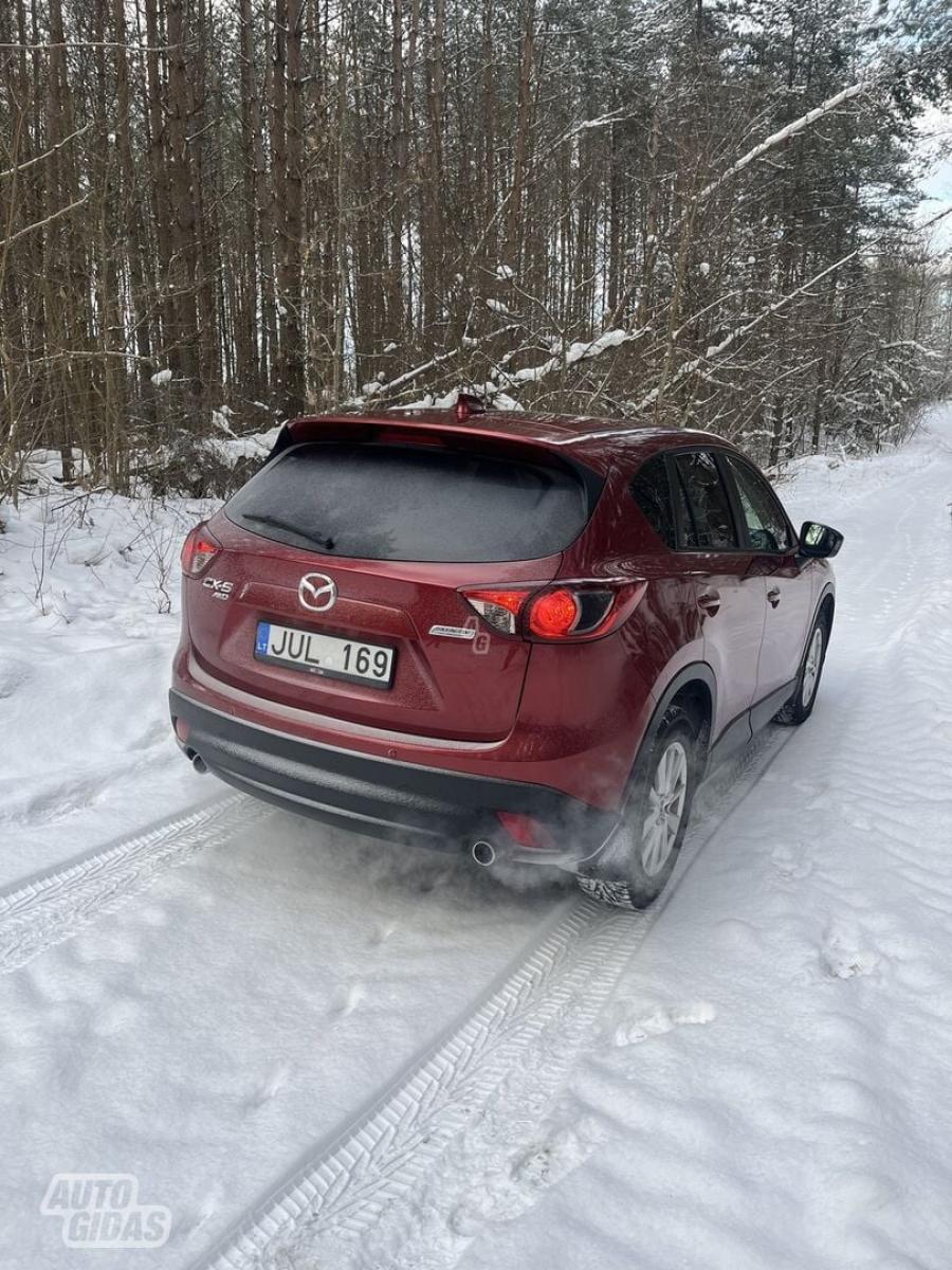 Red Mazda CX-5 2013 in Vievis, with an engine capacity of 2.20 L and mileage of 243 thousand km for 7300 €, photo 3 on AUTOMOTO.COM.LV