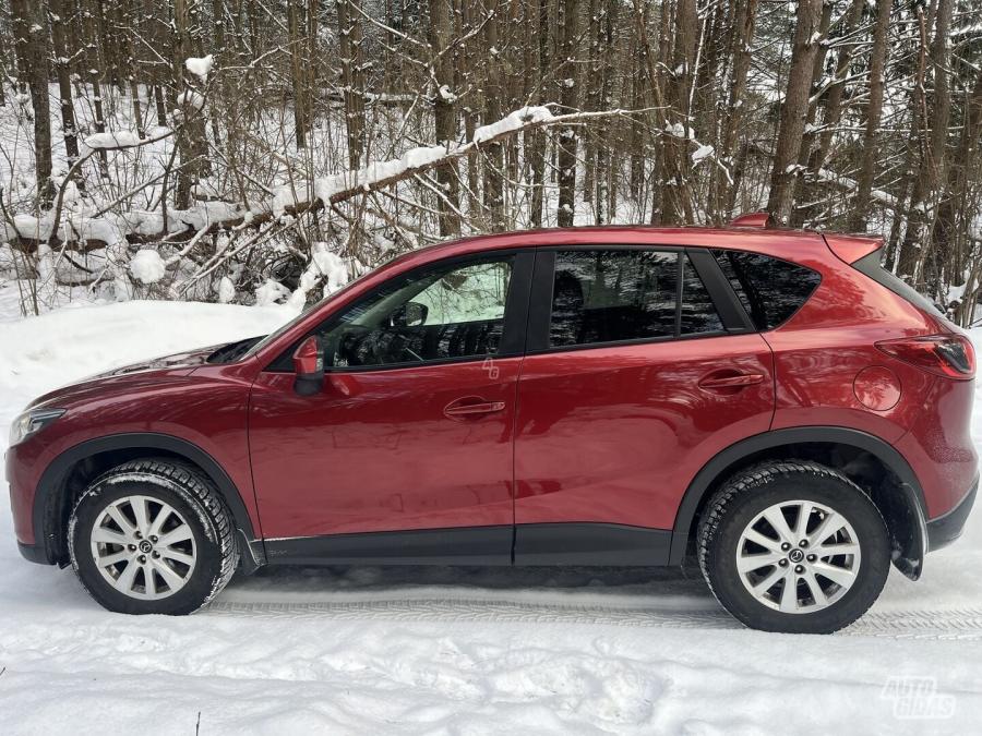 Red Mazda CX-5 2013 in Vievis, with an engine capacity of 2.20 L and mileage of 243 thousand km for 7300 €, photo 5 on AUTOMOTO.COM.LV