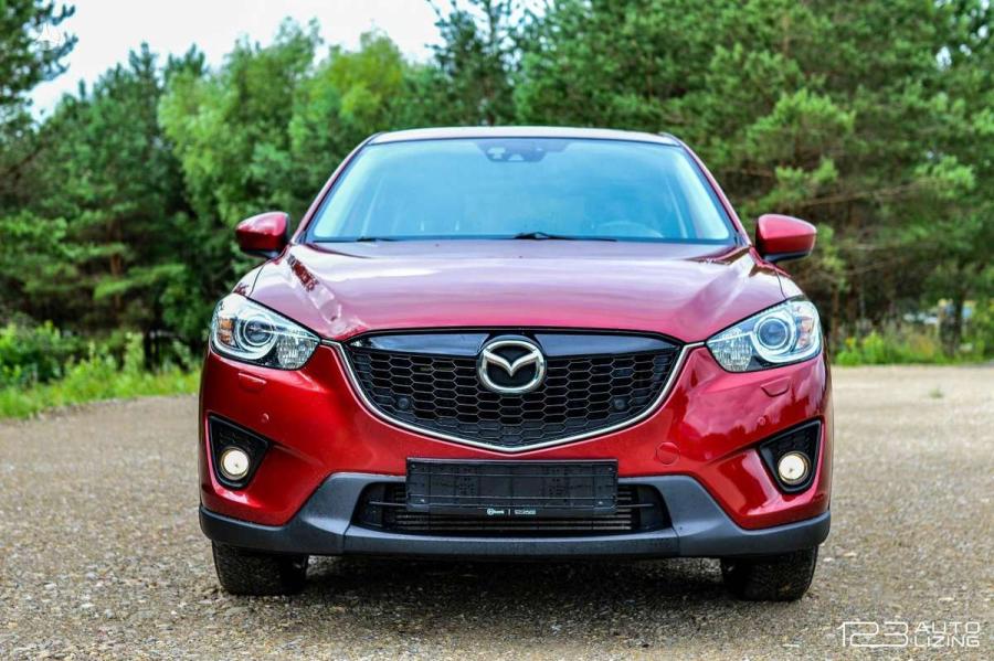 Red Mazda CX-5 2013 in Kretinga, with an engine capacity of 2.20 L and mileage of 218 thousand km for 7750 €, photo 5 on AUTOMOTO.COM.LV