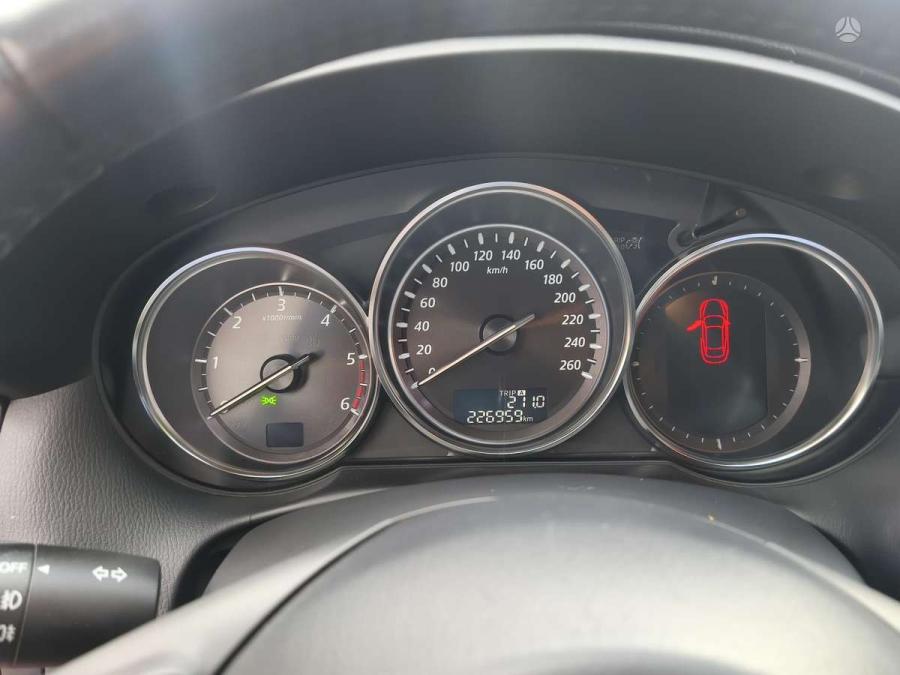 Red Mazda CX-5 2013 in Prienai, with an engine capacity of 2.19 L and mileage of 220 thousand km for 2400 €, photo 8 on AUTOMOTO.COM.LV