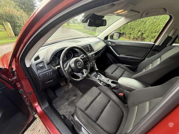 Mazda CX-5 2013 in Ukmerge on AUTOMOTO.COM.LV Red Mazda CX-5 2013 in Ukmerge, with an engine capacity of 2.19 L and mileage of 278 thousand km for 5500 €, photo 8 on AUTOMOTO.COM.LV