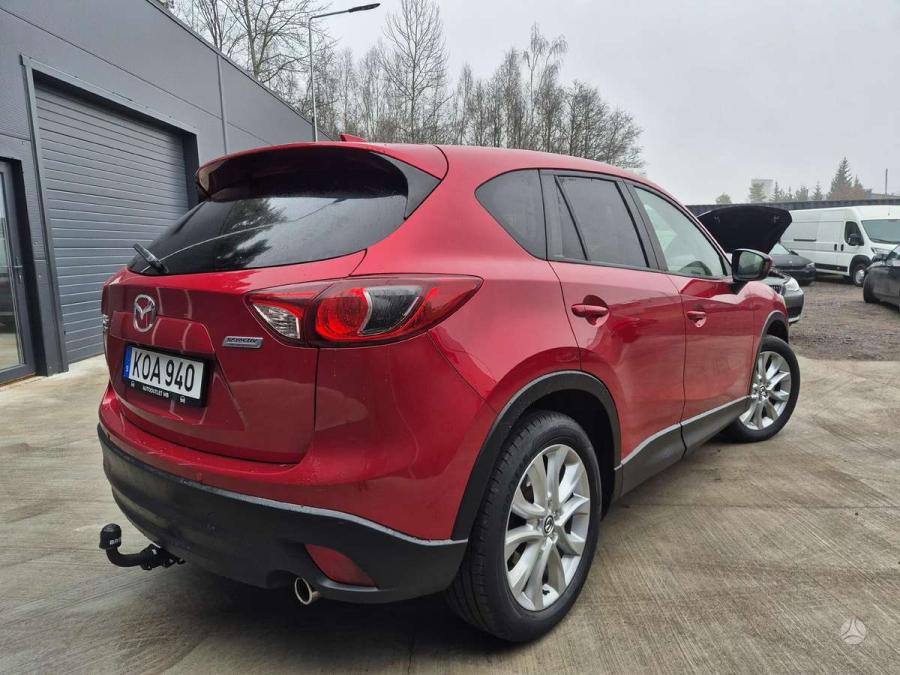Red Mazda CX-5 2014 in Utena, with an engine capacity of 2.19 L and mileage of 261 thousand km for 6490 €, photo 3 on AUTOMOTO.COM.LV