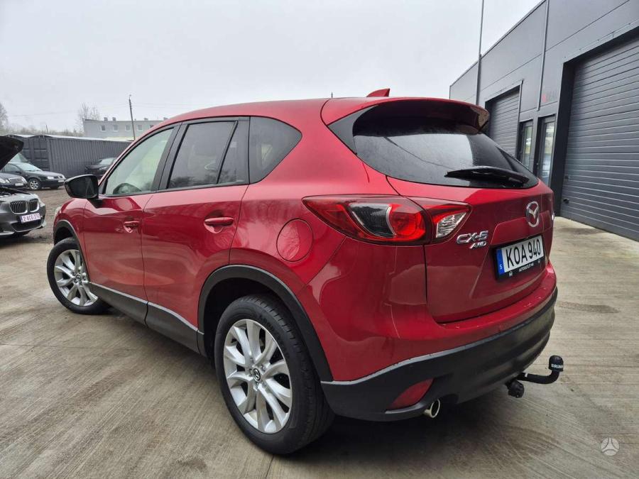 Red Mazda CX-5 2014 in Utena, with an engine capacity of 2.19 L and mileage of 261 thousand km for 6490 €, photo 4 on AUTOMOTO.COM.LV