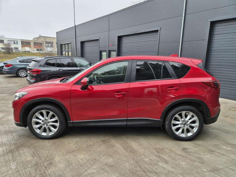 Red Mazda CX-5 2014 in Utena, with an engine capacity of 2.19 L and mileage of 261 thousand km for 6490 €, photo 5 on AUTOMOTO.COM.LV
