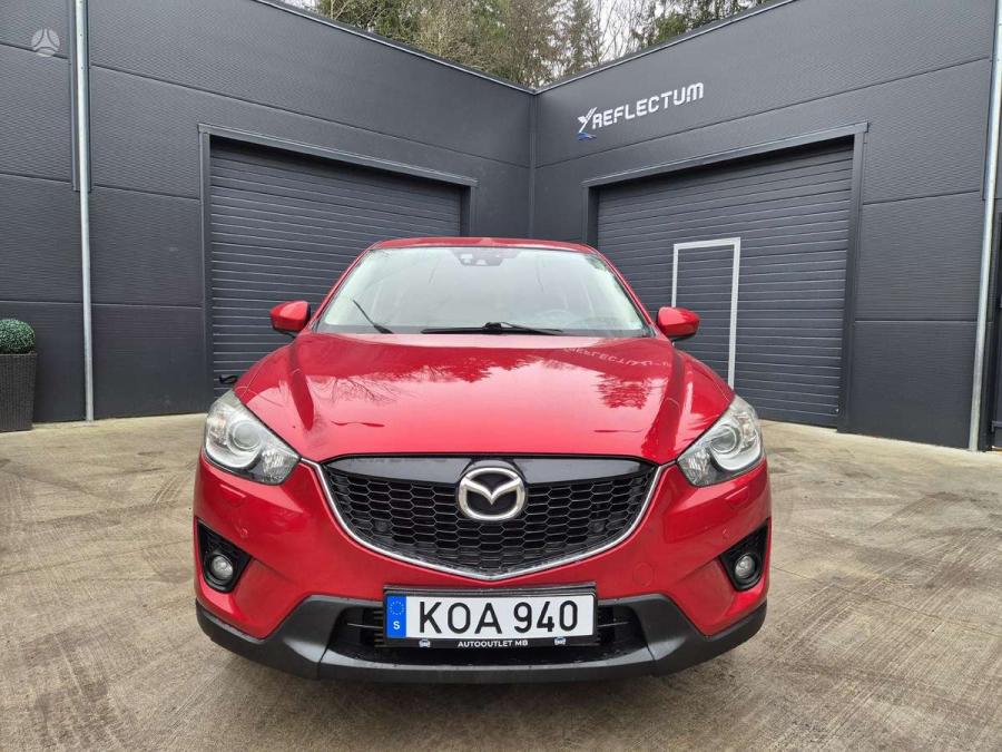 Red Mazda CX-5 2014 in Utena, with an engine capacity of 2.19 L and mileage of 261 thousand km for 6490 €, photo 7 on AUTOMOTO.COM.LV