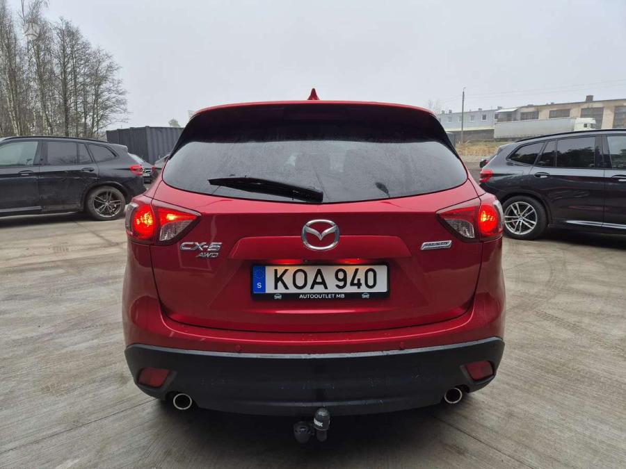 Red Mazda CX-5 2014 in Utena, with an engine capacity of 2.19 L and mileage of 261 thousand km for 6490 €, photo 9 on AUTOMOTO.COM.LV