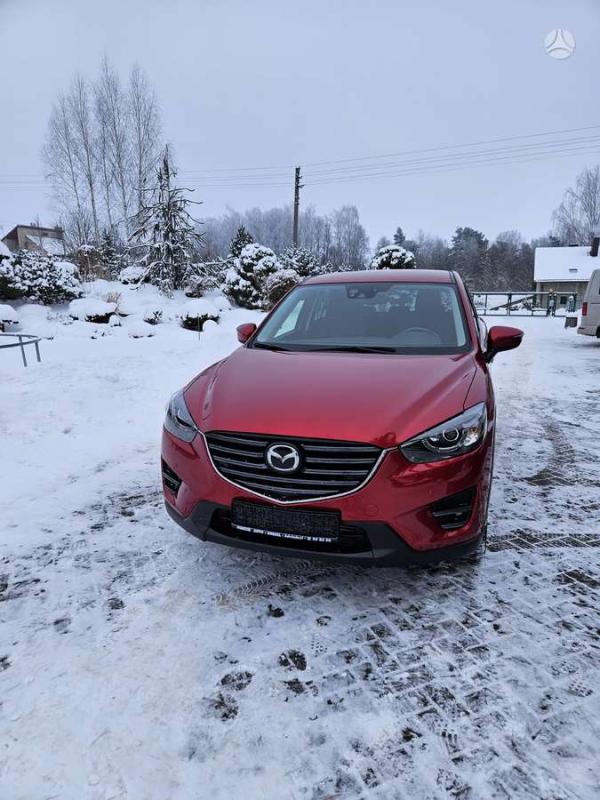 Red Mazda CX-5 2015 in Utena, with an engine capacity of 2.20 L and mileage of 98 thousand km for 13700 €, photo 1 on AUTOMOTO.COM.LV