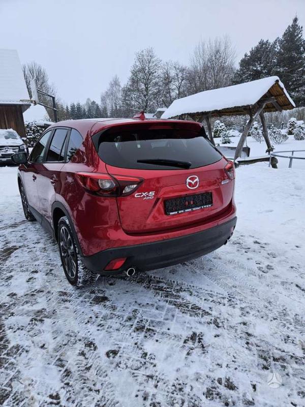 Red Mazda CX-5 2015 in Utena, with an engine capacity of 2.20 L and mileage of 98 thousand km for 13700 €, photo 5 on AUTOMOTO.COM.LV