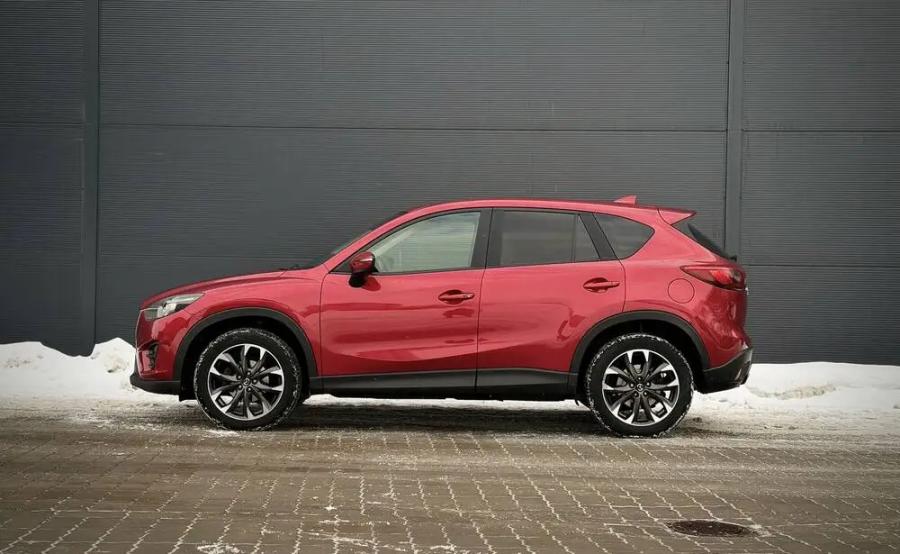 Red Mazda CX-5 2015 in Riga, with an engine capacity of 2.20 L and mileage of 243 thousand km for 8990 €, photo 3 on AUTOMOTO.COM.LV