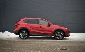 Red Mazda CX-5 2015 in Riga, with an engine capacity of 2.20 L and mileage of 243 thousand km for 8990 €, photo 6 on AUTOMOTO.COM.LV