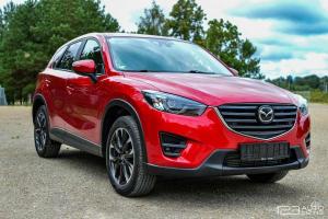 Red Mazda CX-5 2015 in Kretinga, with an engine capacity of 2.20 L and mileage of 193 thousand km for 9950 €, photo 5 on AUTOMOTO.COM.LV