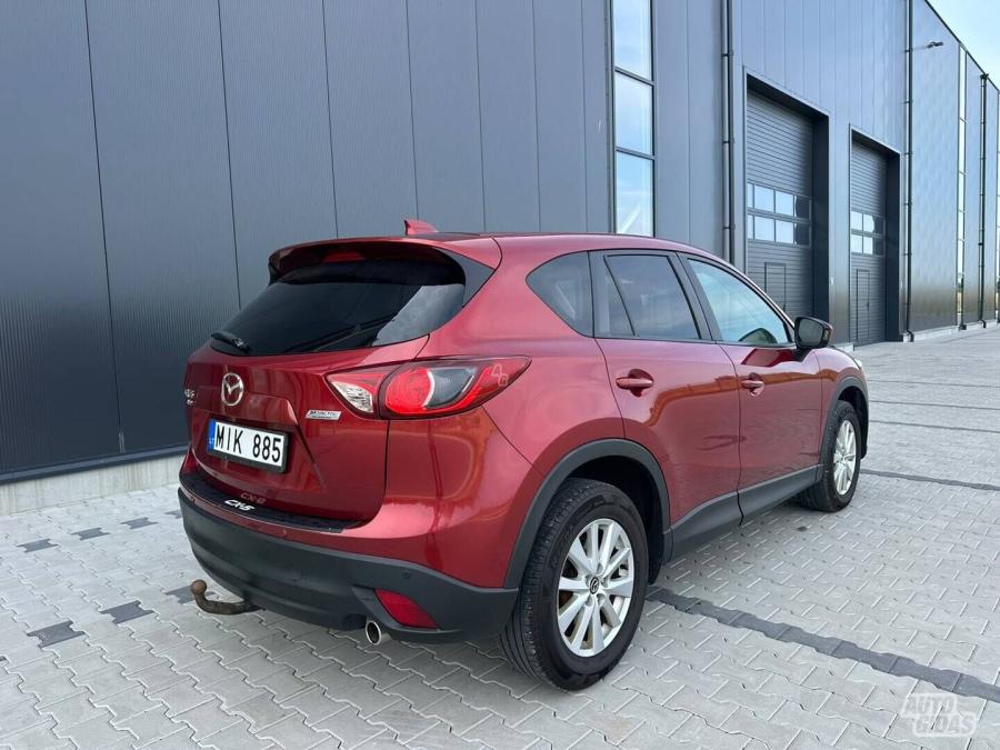 Red Mazda CX-5 2015 in Klaipeda, with an engine capacity of 2.20 L and mileage of 268 thousand km for 7400 €, photo 10 on AUTOMOTO.COM.LV