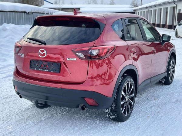 Red Mazda CX-5 2016 in Telschi, with an engine capacity of 2.19 L and mileage of 162 thousand km for 11800 €, photo 7 on AUTOMOTO.COM.LV