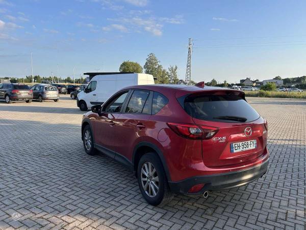 Red Mazda CX-5 2016 in Taurage, with an engine capacity of 2.19 L and mileage of 234 thousand km for 5990 €, photo 6 on AUTOMOTO.COM.LV