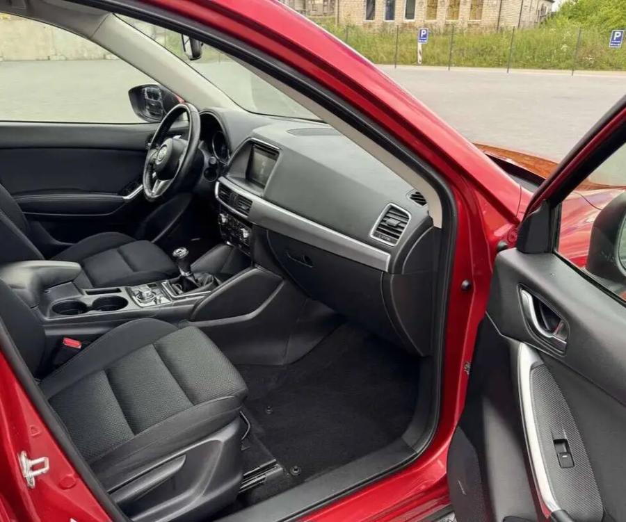 Red Mazda CX-5 2016 in Telschi, with an engine capacity of 2.20 L and mileage of 200 thousand km for 7990 €, photo 16 on AUTOMOTO.COM.LV