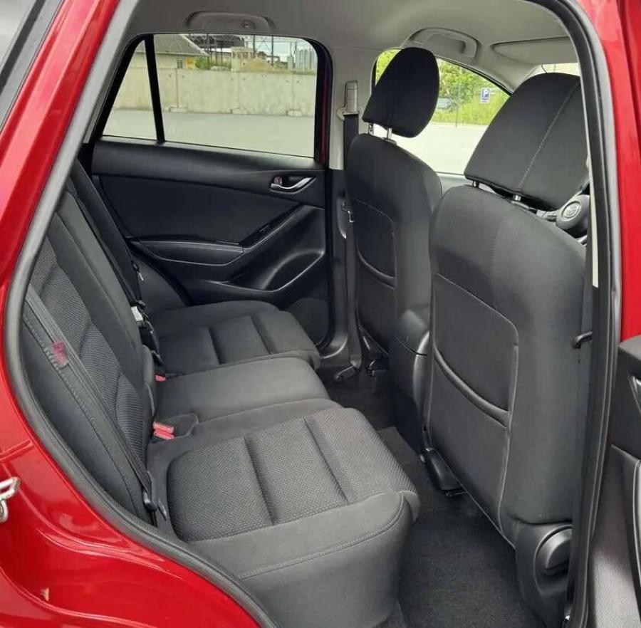 Red Mazda CX-5 2016 in Telschi, with an engine capacity of 2.20 L and mileage of 200 thousand km for 7990 €, photo 18 on AUTOMOTO.COM.LV