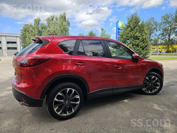 Red Mazda CX-5 2016 in Riga, with an engine capacity of 2.20 L and mileage of 227 thousand km for 9250 €, photo 6 on AUTOMOTO.COM.LV