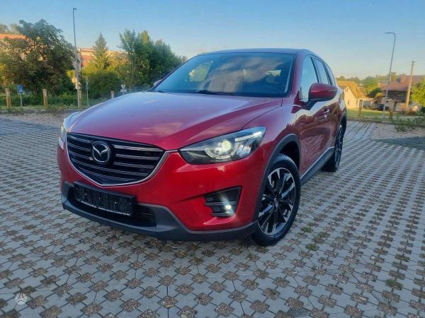 Red Mazda CX-5 2016 in Prienai, with an engine capacity of 2.19 L and mileage of 204 thousand km for 9500 €, photo 1 on AUTOMOTO.COM.LV