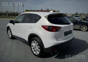 White Mazda CX-5 2013 in Vilnius, with an engine capacity of 2.20 L and mileage of 189 thousand km for 6499 €, photo 6 on AUTOMOTO.COM.LV