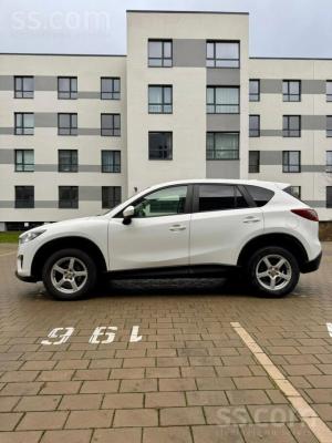 White Mazda CX-5 2013 in Riga, with an engine capacity of 2.20 L and mileage of 213 thousand km for 7399 €, photo 4 on AUTOMOTO.COM.LV