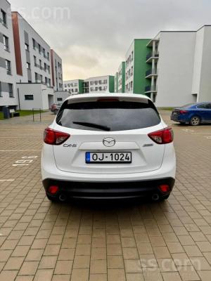 White Mazda CX-5 2013 in Riga, with an engine capacity of 2.20 L and mileage of 213 thousand km for 7399 €, photo 6 on AUTOMOTO.COM.LV