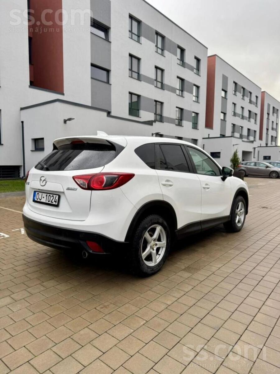 White Mazda CX-5 2013 in Riga, with an engine capacity of 2.20 L and mileage of 213 thousand km for 7399 €, photo 7 on AUTOMOTO.COM.LV