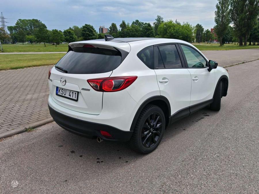 White Mazda CX-5 2013 in Klaipeda, with an engine capacity of 2.00 L and mileage of 210 thousand km for 9500 €, photo 4 on AUTOMOTO.COM.LV