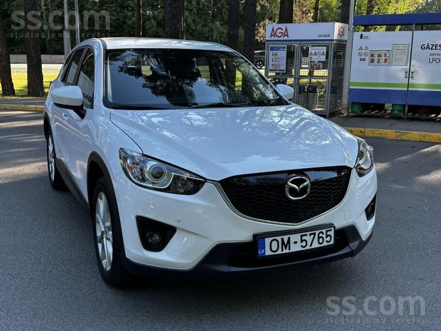 White Mazda CX-5 2014 in Riga, with an engine capacity of 2.20 L and mileage of 205 thousand km for 8799 €, photo 1 on AUTOMOTO.COM.LV