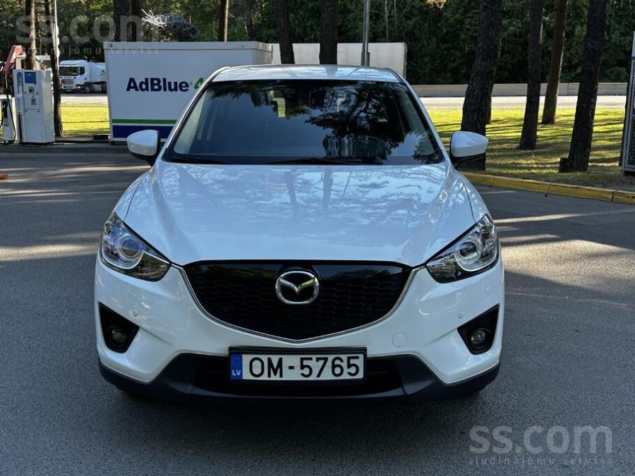 White Mazda CX-5 2014 in Riga, with an engine capacity of 2.20 L and mileage of 205 thousand km for 8799 €, photo 4 on AUTOMOTO.COM.LV