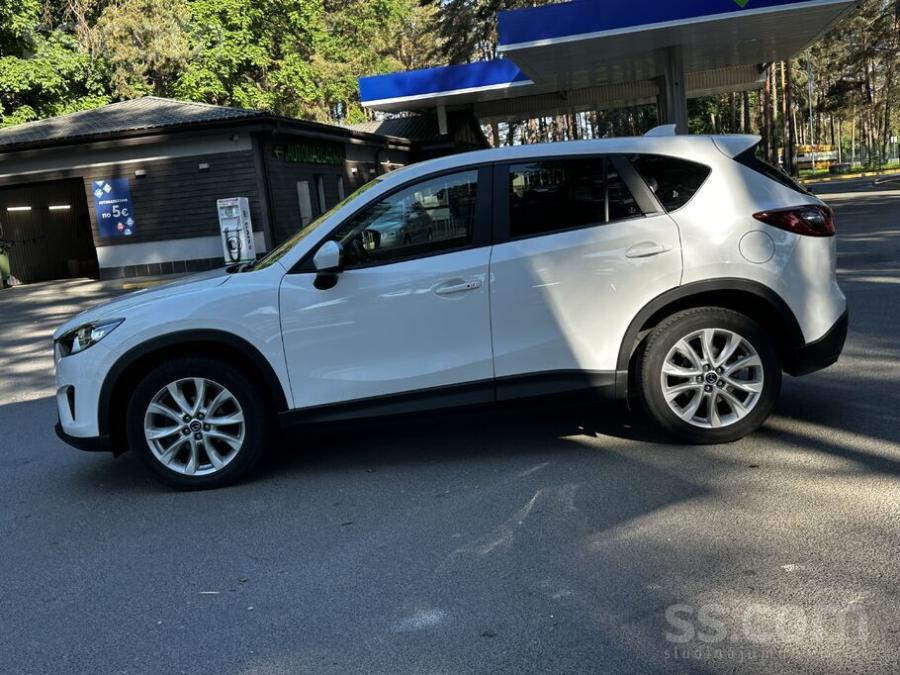 White Mazda CX-5 2014 in Riga, with an engine capacity of 2.20 L and mileage of 205 thousand km for 8799 €, photo 9 on AUTOMOTO.COM.LV