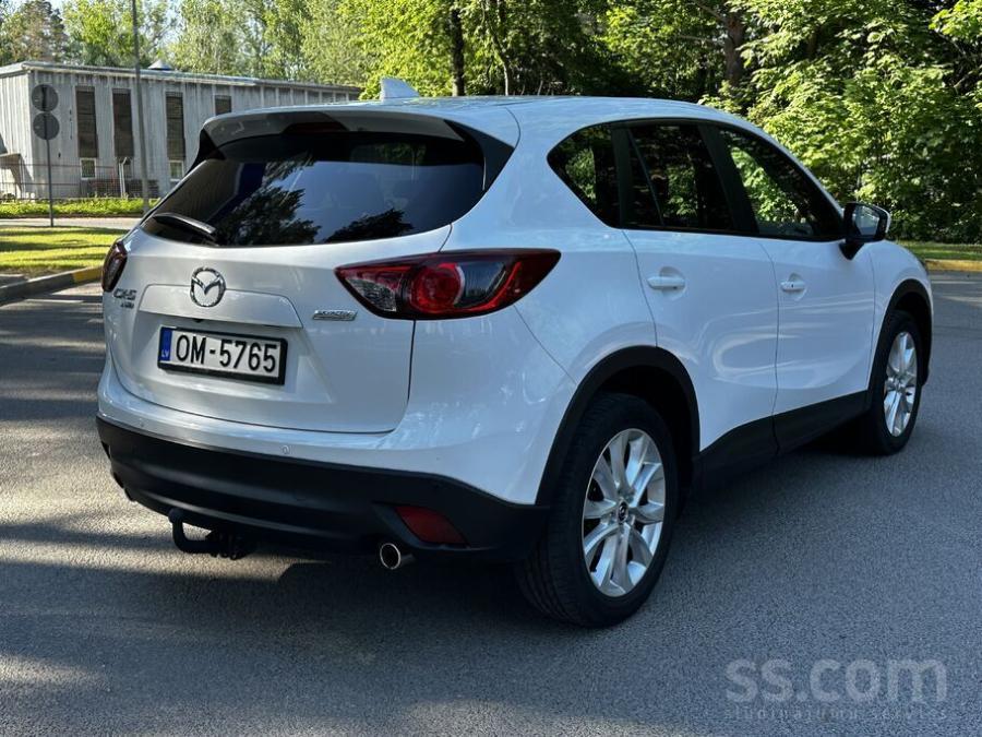 White Mazda CX-5 2014 in Riga, with an engine capacity of 2.20 L and mileage of 205 thousand km for 8799 €, photo 10 on AUTOMOTO.COM.LV