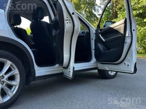 White Mazda CX-5 2014 in Riga, with an engine capacity of 2.20 L and mileage of 205 thousand km for 8799 €, photo 12 on AUTOMOTO.COM.LV