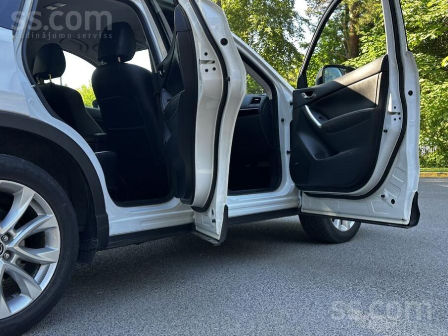 White Mazda CX-5 2014 in Riga, with an engine capacity of 2.20 L and mileage of 205 thousand km for 8799 €, photo 12 on AUTOMOTO.COM.LV