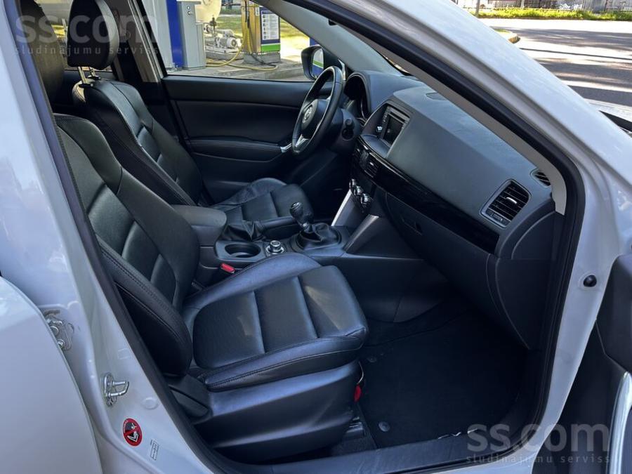 White Mazda CX-5 2014 in Riga, with an engine capacity of 2.20 L and mileage of 205 thousand km for 8799 €, photo 14 on AUTOMOTO.COM.LV