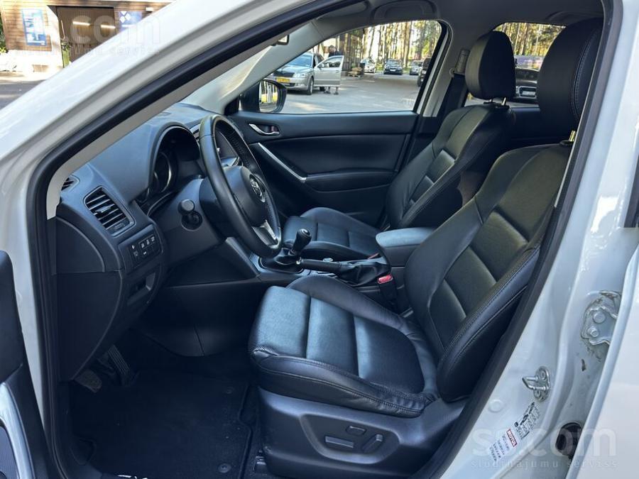 White Mazda CX-5 2014 in Riga, with an engine capacity of 2.20 L and mileage of 205 thousand km for 8799 €, photo 23 on AUTOMOTO.COM.LV