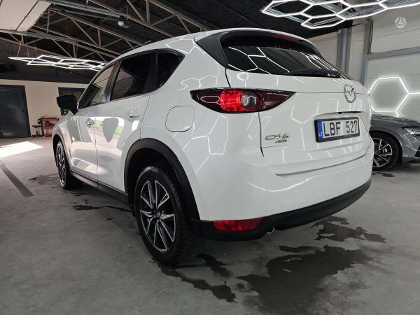 White Mazda CX-5 2018 in Mazeikiai, with an engine capacity of 2.49 L and mileage of 147 thousand km for 19500 €, photo 2 on AUTOMOTO.COM.LV