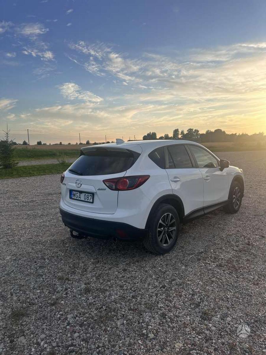 White Mazda CX-5 2012 in Klaipeda, with an engine capacity of 2.20 L and mileage of 220 thousand km for 8900 €, photo 6 on AUTOMOTO.COM.LV