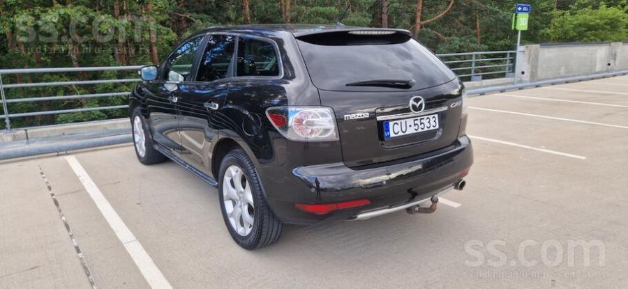 Black Mazda CX-7 2012 in Riga, with an engine capacity of 2.20 L and mileage of 200 thousand km for 4880 €, photo 5 on AUTOMOTO.COM.LV