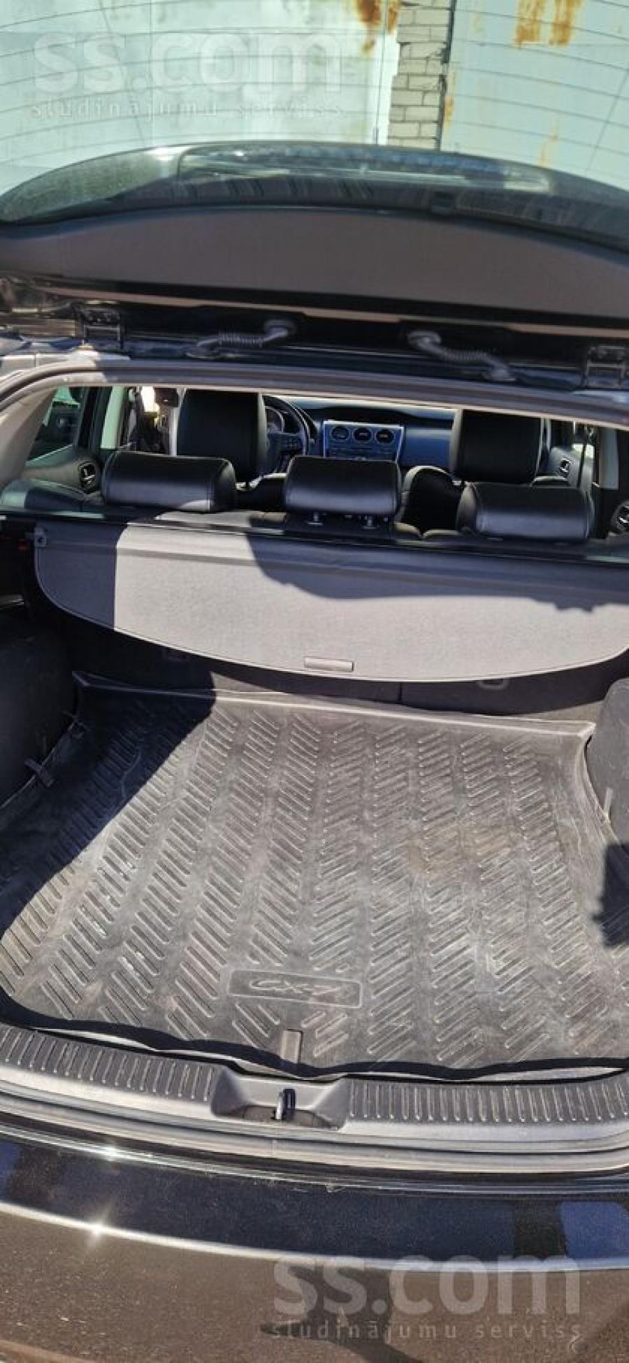 Black Mazda CX-7 2012 in Riga, with an engine capacity of 2.20 L and mileage of 200 thousand km for 4880 €, photo 12 on AUTOMOTO.COM.LV