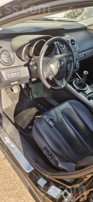 Black Mazda CX-7 2012 in Riga, with an engine capacity of 2.20 L and mileage of 200 thousand km for 4880 €, photo 14 on AUTOMOTO.COM.LV