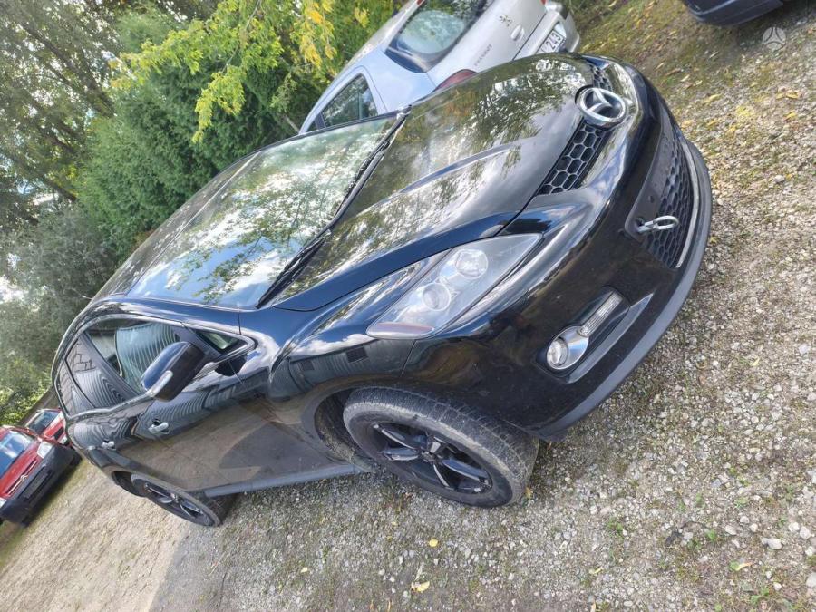 Black Mazda CX-7 2008 in Panevezys, with an engine capacity of 2.30 L and mileage of 210 thousand km for 950 €, photo 6 on AUTOMOTO.COM.LV