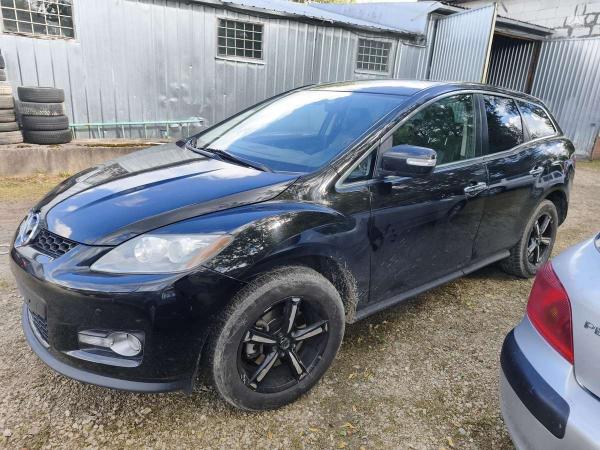 Melns Mazda CX-7 2008 Panevēža, ar dzinēja tilpumu 2.30 L un nobraukumu 210 tūkst. km par 950 €, foto 9 vietnē AUTOMOTO.COM.LV